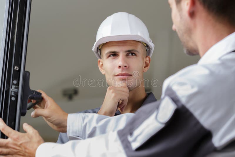 Concentrated Young Builder Installing Window Stock Photo - Image of ...