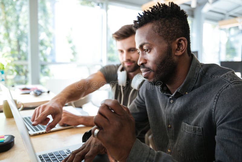 Concentrated Young Colleagues Sitting in Office Coworking Stock Image ...