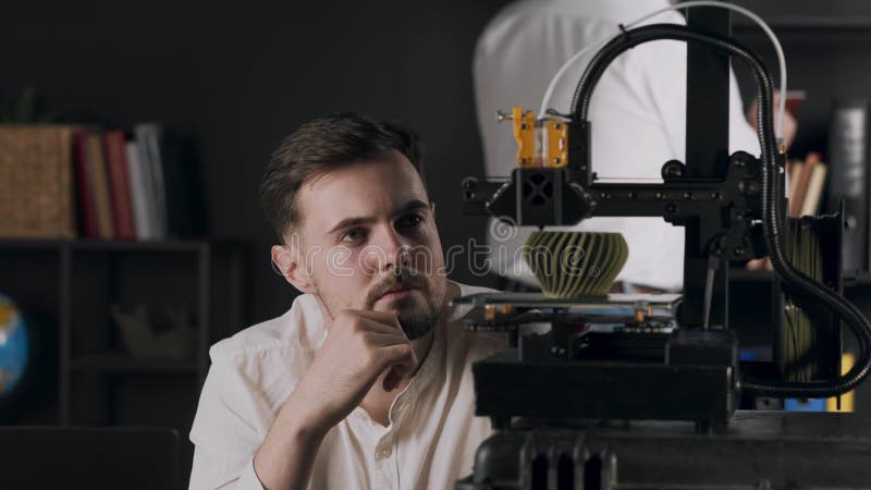 A Concentrated Young Guy Student or Engineer with Interest Observes the ...