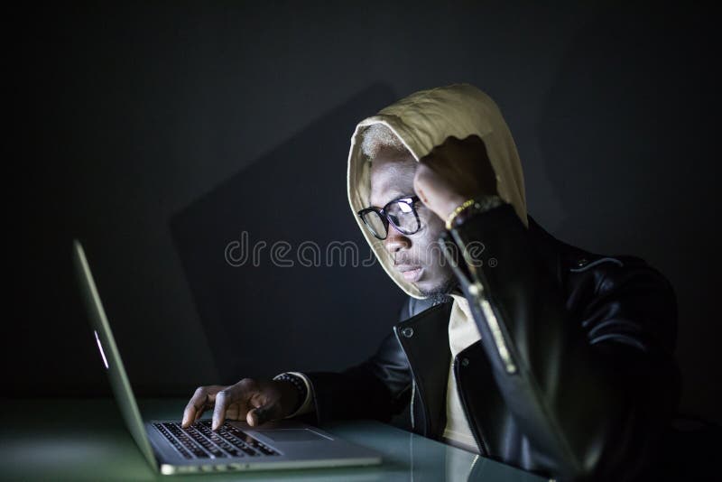Concentrated Young Afro American Hacker Using Computer and Stealing ...