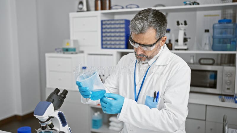 Concentrated Young Hispanic Man, Grey-haired and Handsome, Meticulously ...