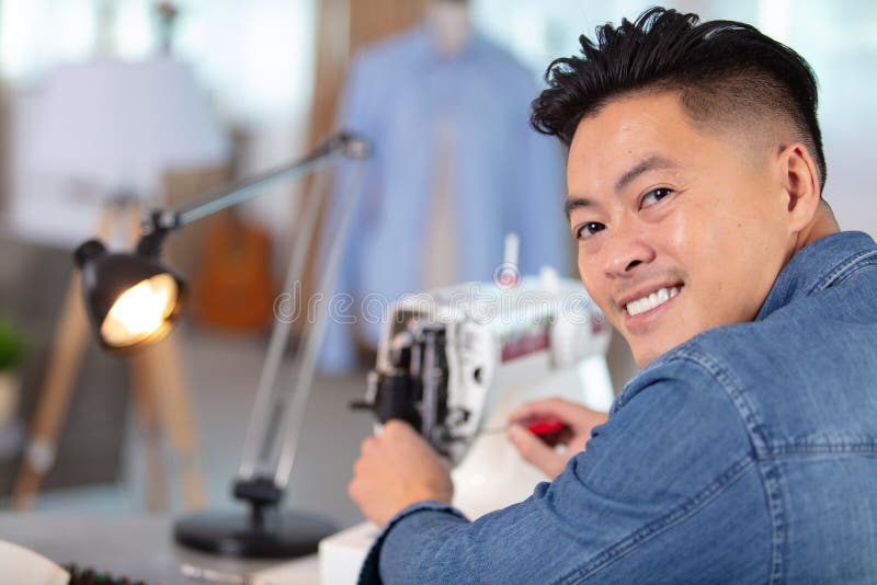 Concentrated Young Male Tailor Sewing in Workshop Stock Image - Image ...