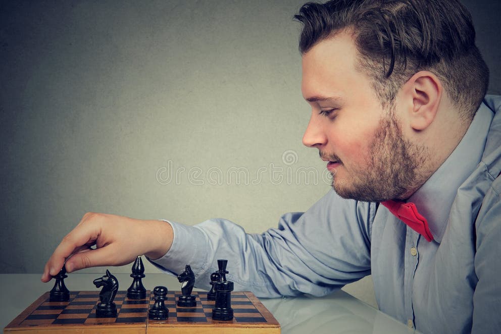 Concentrated Young Man Playing Chess Stock Photo - Image of opposition ...