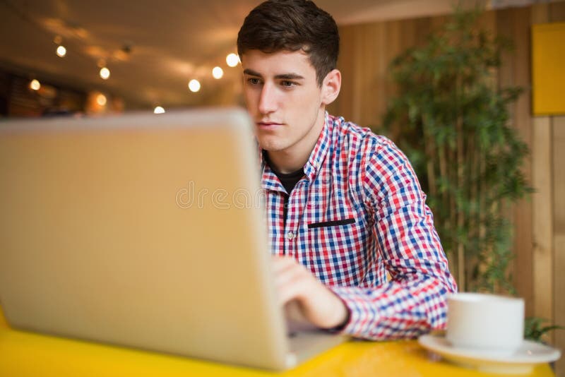 Concentrated Young Man Using Laptop Stock Image - Image of coffee ...
