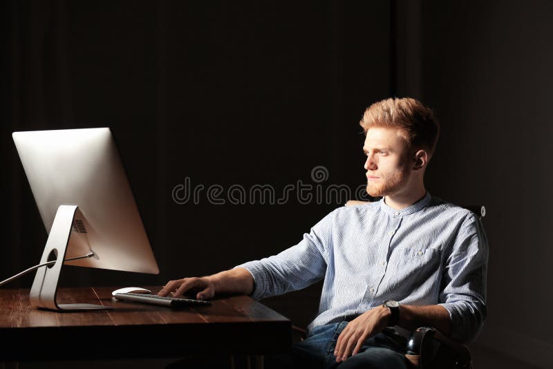 Concentrated Young Man Working in Office at Night Stock Photo - Image ...