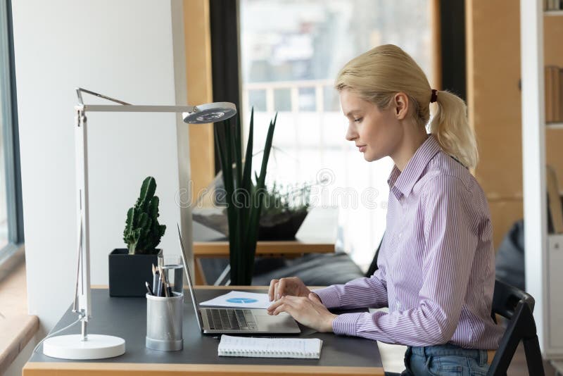 Concentrated Young Millennial Female Freelancer Working on Computer ...
