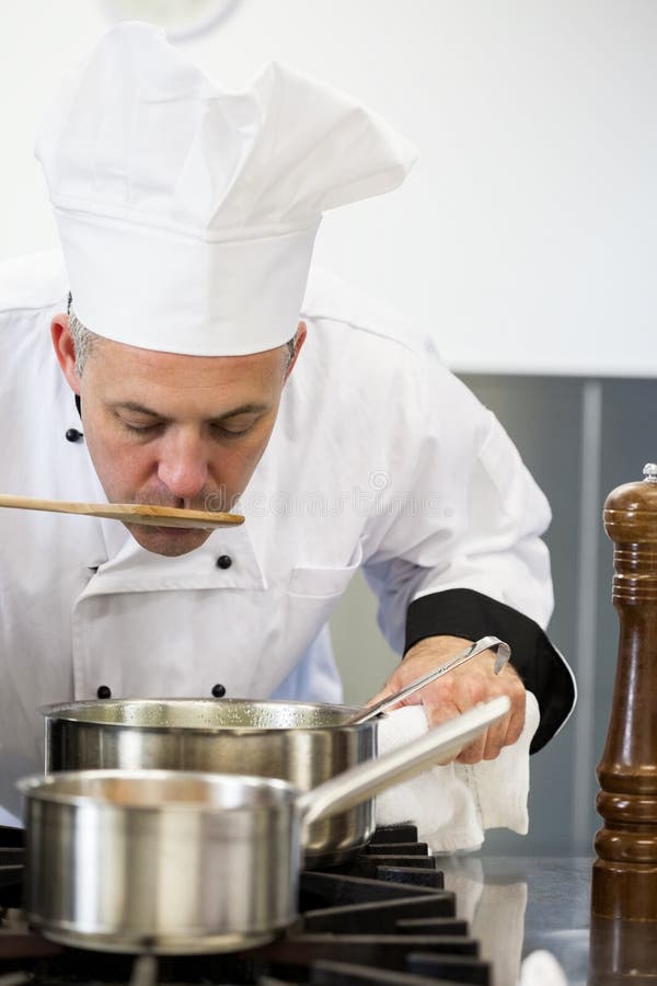 Concentrating Head Chef Tasting Sauce with Wooden Spoon Stock Image ...