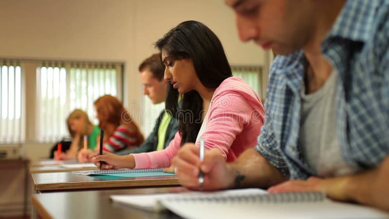 Concentrating Students Taking Notes in Class Stock Video - Video of ...