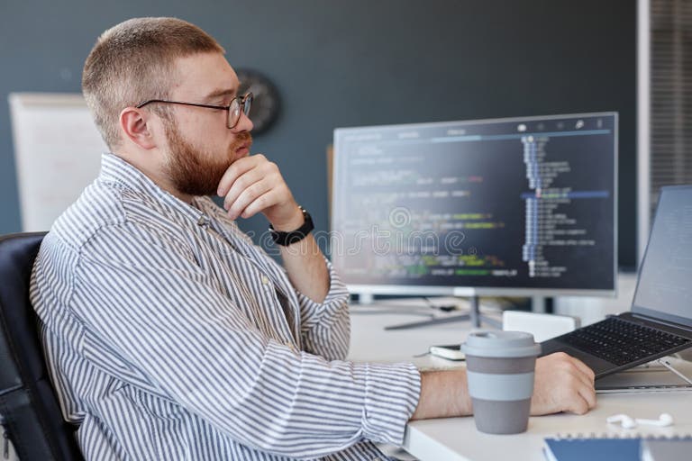 Concentrating on Work while Using Laptop in Office Stock Image - Image ...