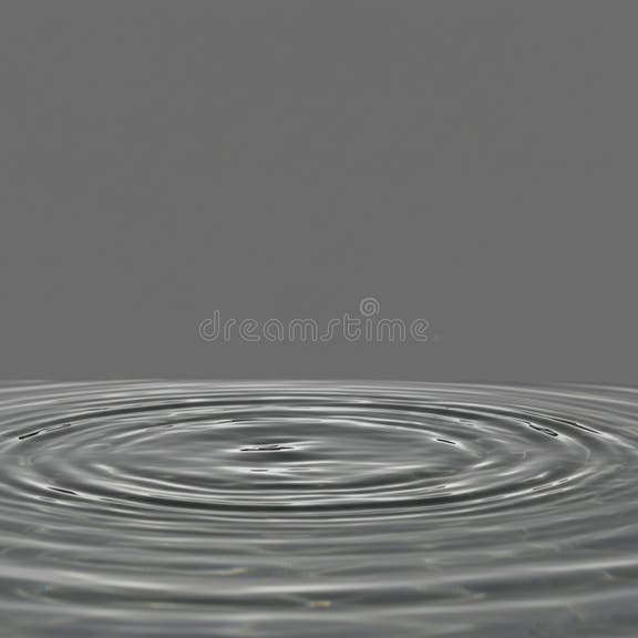 Concentric Water Ripples Spread Across a Smooth, Reflective Surface ...
