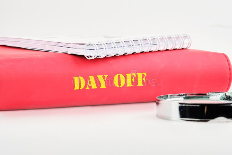 Concept of Absence from Work and Day Off. Text DAY OFF on the Cover of ...