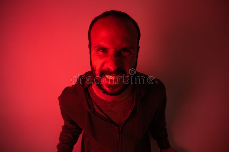 Concept Af Angry and Abusive Man with Red Light. Studio Portrait of ...