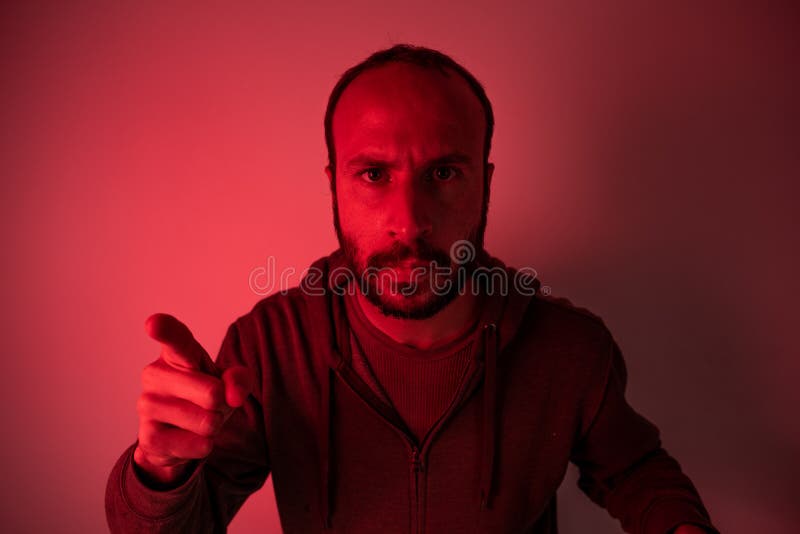 Concept Af Angry and Abusive Man with Red Light. Studio Portrait of ...