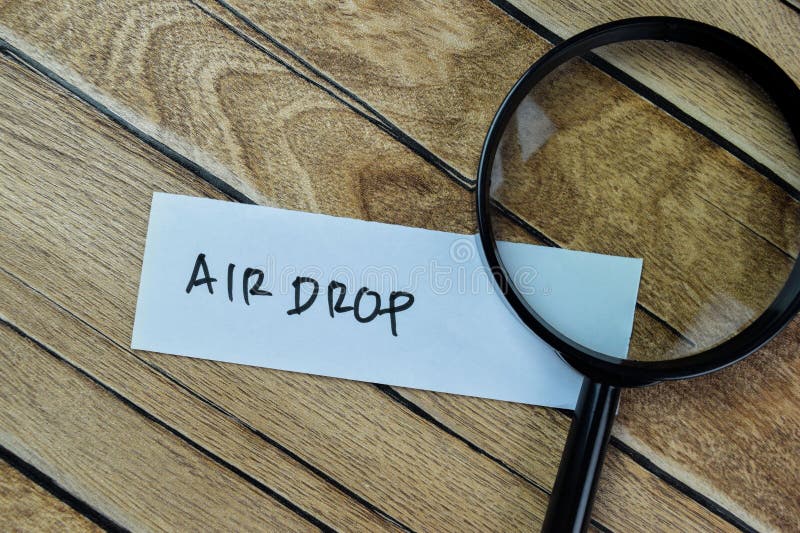 Concept of Air Drop Write on Sticky Notes Isolated on Wooden Table ...