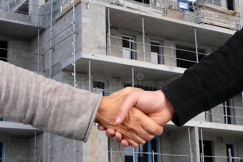 Concept of Apartment Sale on Plan with a Handshake in Front of a ...