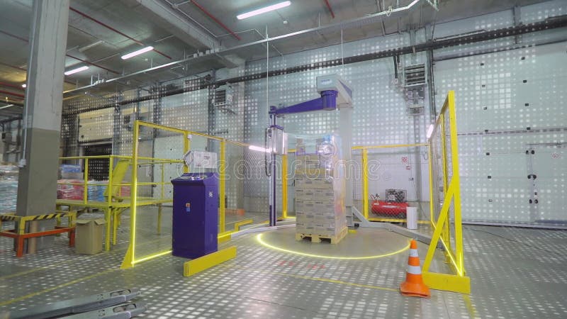 The Concept of Automatic Packaging of Goods in Film. Packing Boxes in ...