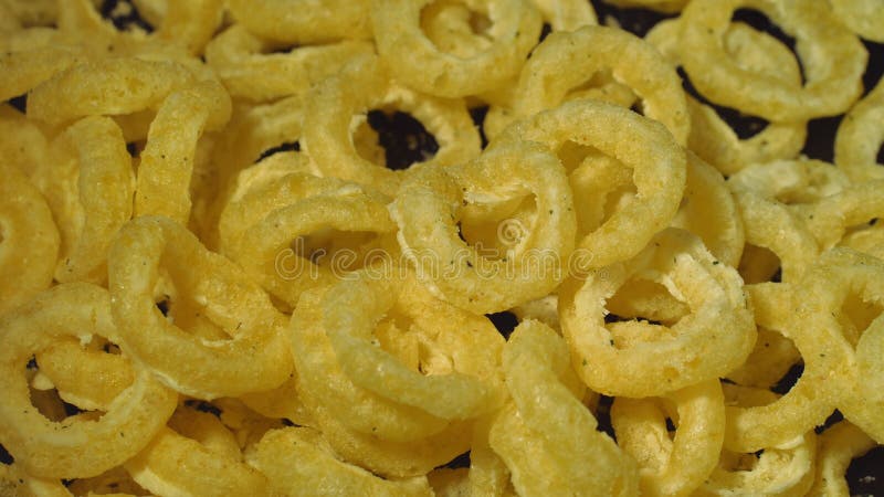 Rotating Corn Rings on a Black Background. Onion Rings Stock Footage ...