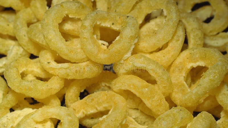 Rotating Corn Rings on a Black Background. Onion Rings Stock Footage ...
