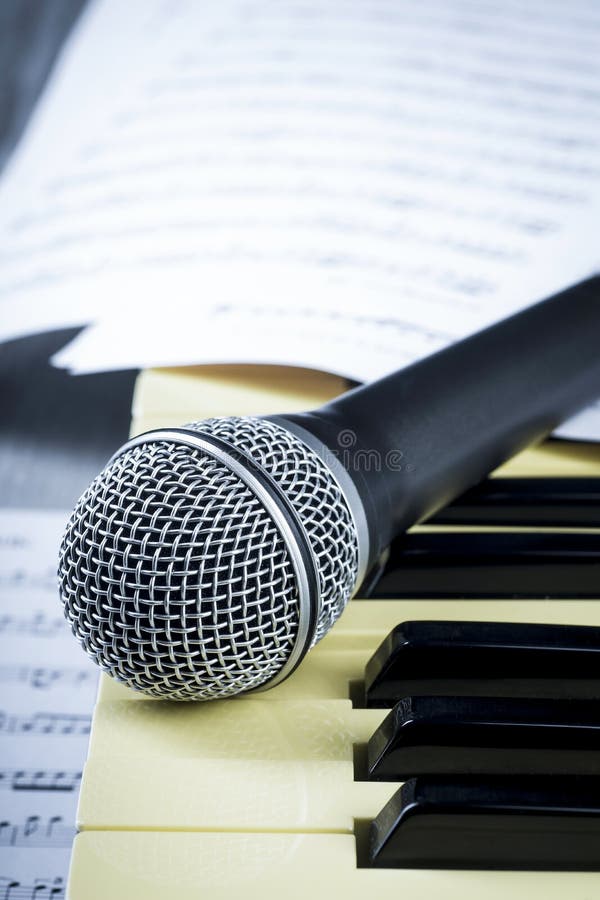 Concept Behind the Music the Microphone and Keys Stock Photo - Image of ...