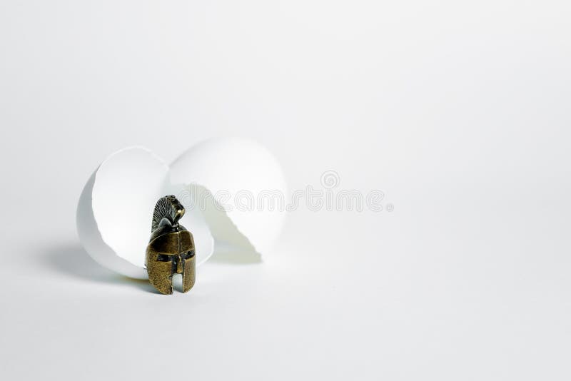 The Concept of the Birth of a Warrior. Gladiator`s Bronze Helmet Next ...