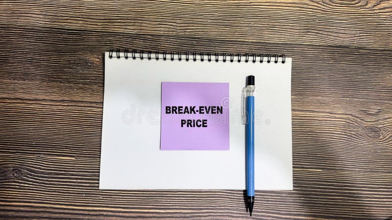 Concept of Break-Even Price Write on Sticky Notes Isolated on Wooden ...