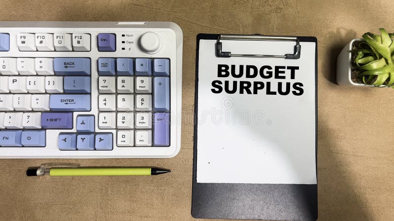 Concept of Budget Surplus Write on Paperwork Isolated on Wooden Table ...