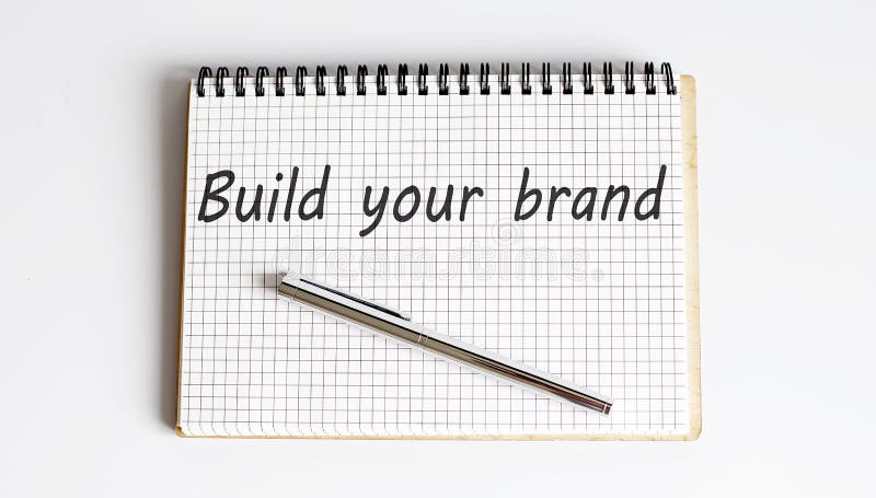 Concept BUILD YOUR BRAND Message on the Notebook on White Background ...