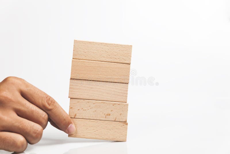 Hand Holding Wooden Blocks on the Stack of Wooden Blocks Stock Photo ...