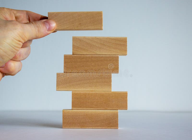 Concept of Building Success Foundation. Men Hand Put Wooden Blocks on ...