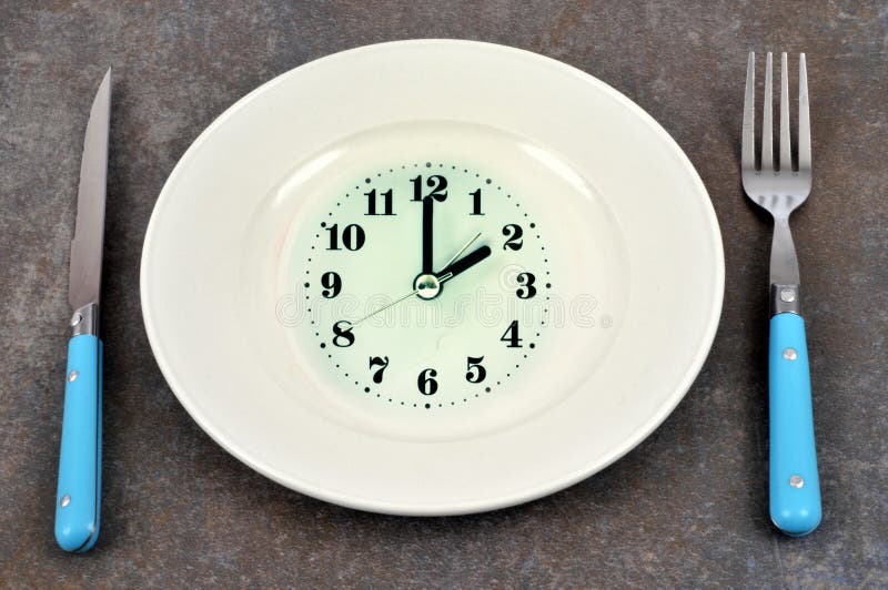 Meal Time Concept with Clock Plate and Cutlery Stock Image - Image of ...