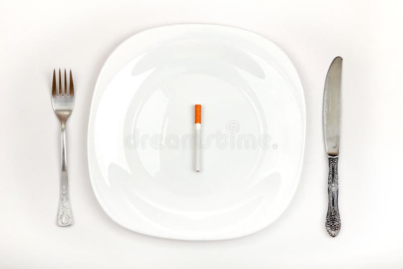 Cigarette on Dinner Plate stock photo. Image of food - 29987004