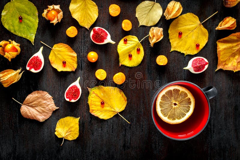 Concept of Cold Autumn - Tea, Leaves on Dark Wood Stock Photo - Image ...