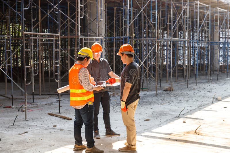 Concept of Construction. Engineer, Architect and Designer Working ... Concept of Construction. Engineer, Architect and Designer Working ...
