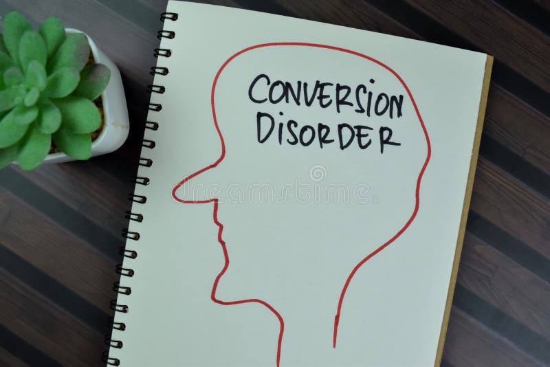 Concept of Conversion Disorder Write on a Book Isolated on Wooden Table ...