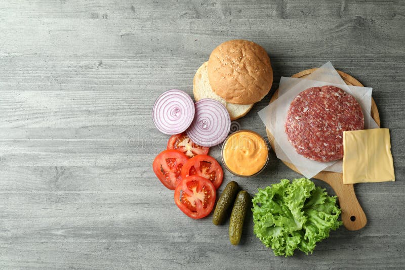 Concept of Cooking Burger on Gray Textured Table Stock Photo - Image of ...