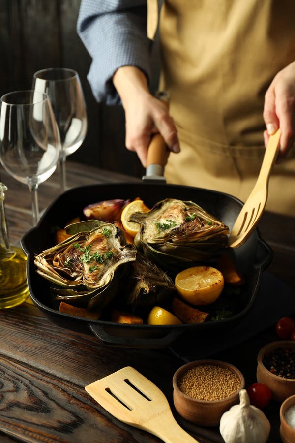 Concept of Cooking, Female Chef Cooked Dish with Artichoke Stock Image ...