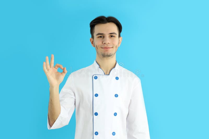 Concept of Cooking, Young Man Chef on Blue Background Stock Image ...