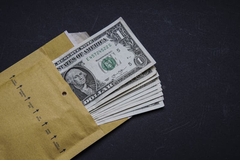 The Concept of Corruption and Bribery. Envelope Full of American Dollar ...