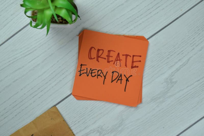 Concept Of Create Every Day Write On Sticky Notes Isolated On Wooden