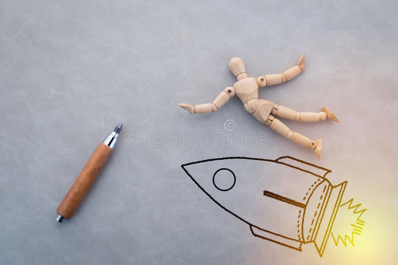 Concept of Creativity Idea with Wooden Figure and Drawing of Rocket ...