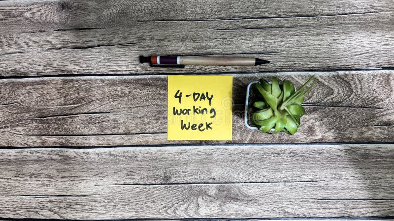 Concept of 4 Day Working Week Write on Sticky Notes Isolated on Wooden ...