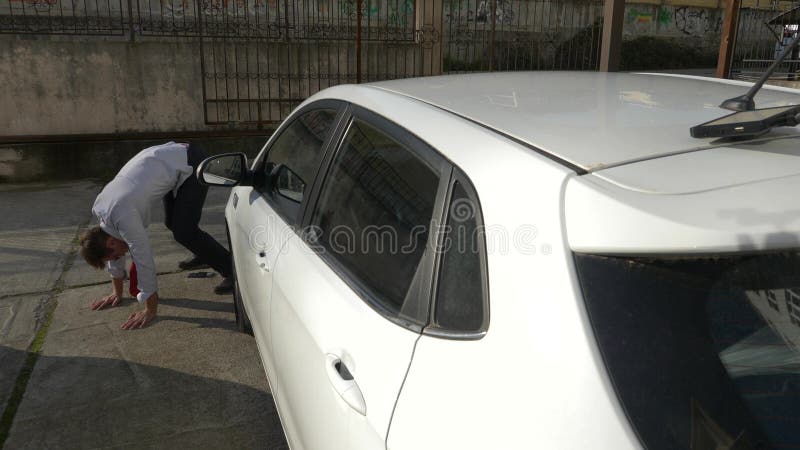 The Concept of Drunk Driving. the Drunk Driver Exits the Car and Slams ...