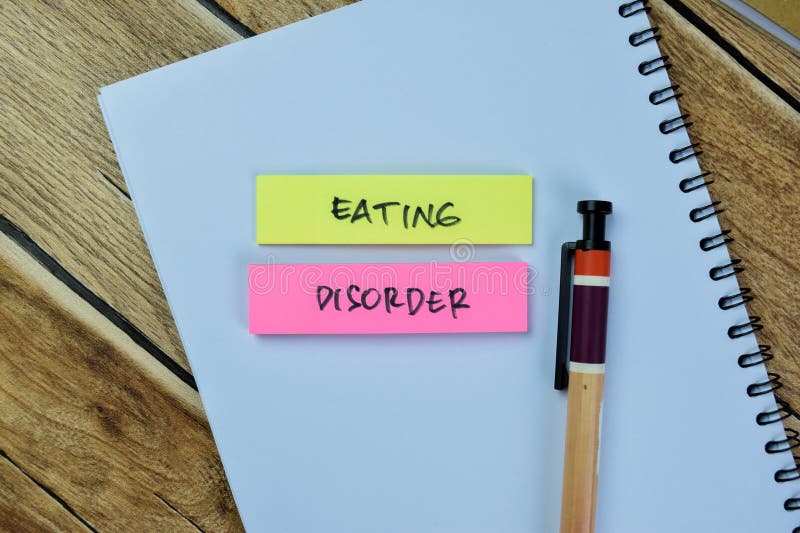 Concept of Eating Disorder Write on Sticky Notes Isolated on Wooden ...