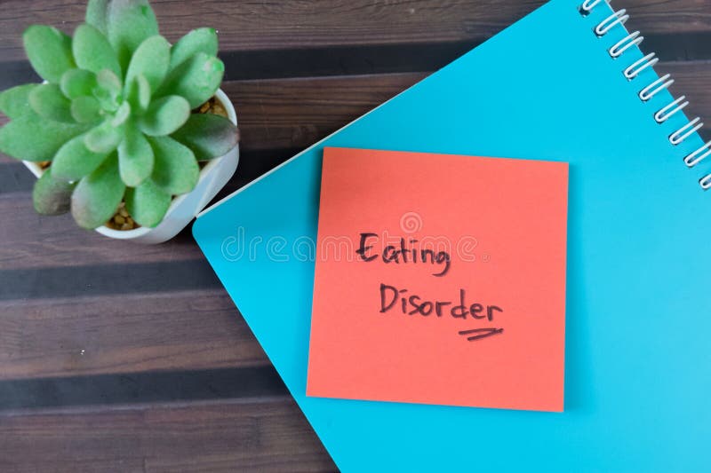 Concept of Eating Disorder Write on Sticky Notes Isolated on Wooden ...