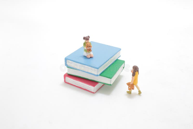 Concept of Education and Reading, the Mini Figure of Kids Stock Photo ...