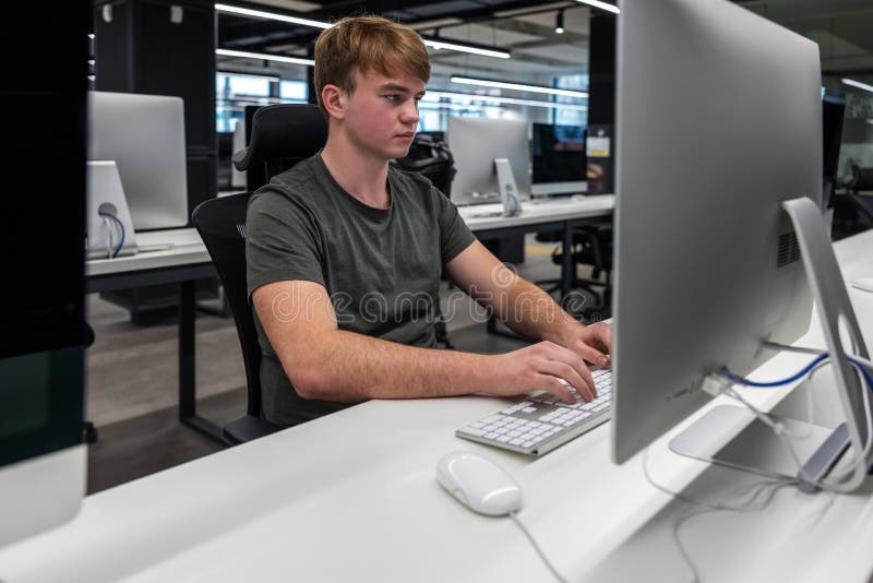 The Concept of Education, a Young Man Sits at a Computer, Teaches ...