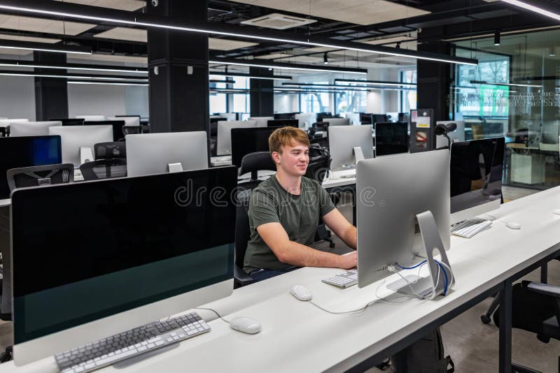 The Concept of Education, a Young Man Sits at a Computer, Teaches ...