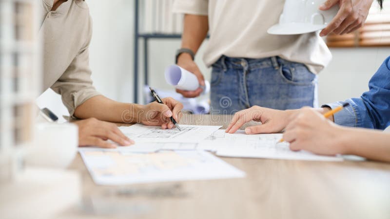 Concept of Engineering Consulting, Engineer Team Point Blueprint of Building To Discussing ...