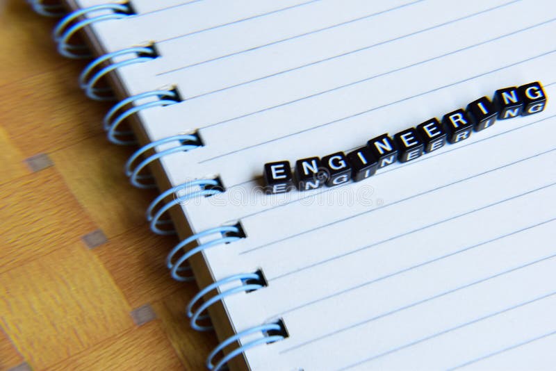 Concept of Engineering on Wooden Cubes with Books in Background Stock ...