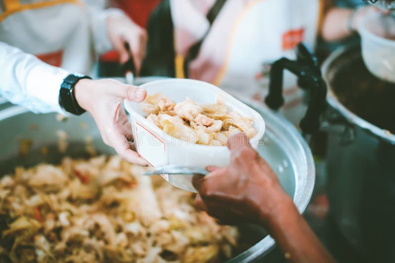 The Concept of Feeding : the Hands of the Poor Receive Food from the ...